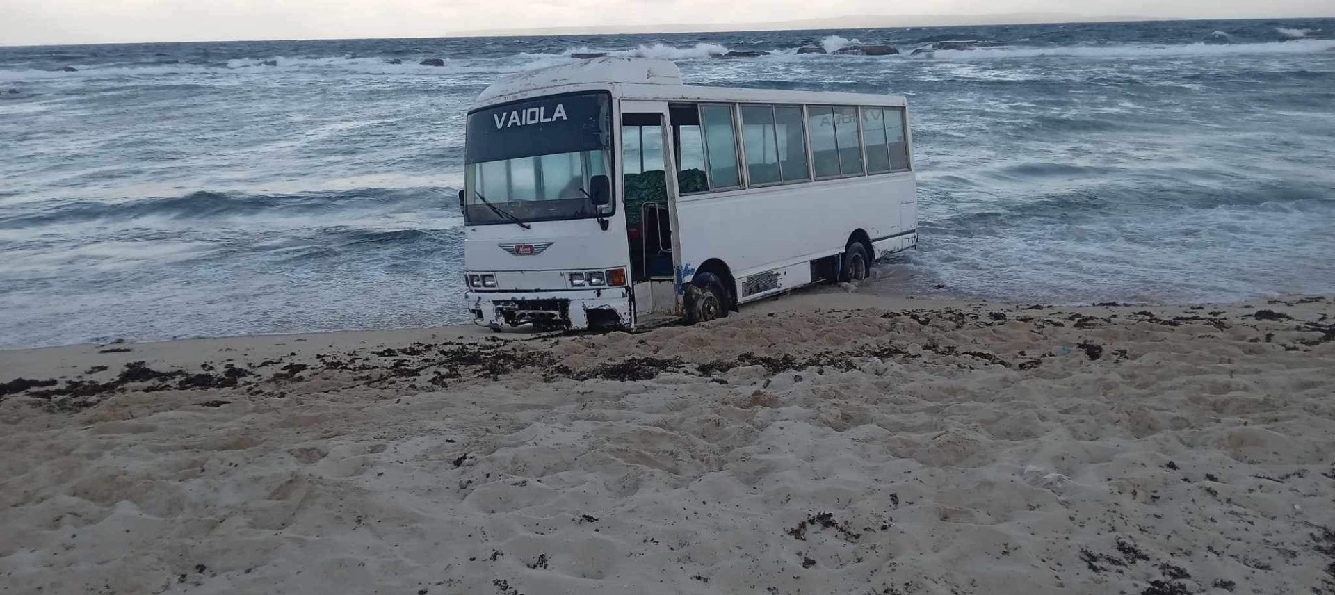 Passenger minibus stuck in ocean at Tongatapu beach removed - Kaniva ...