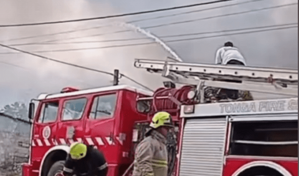 Onlookers mock firefighter as he wrestles to direct fire hose at raging ...